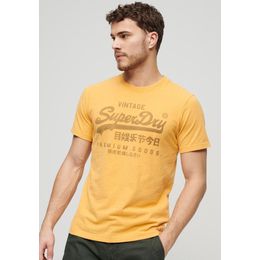 T-Shirt Superdry "Basic Shirt CLASSIC VL HERITAGE T SHIRT mit Logodruck" Gr. XL, gelb (amber gelb), Herren, Jersey, Obermaterial: 100% Baumwolle, unifarben, Shirts, aus pflegeleichter Baumwolle für ein angenehmes Tragegefühl