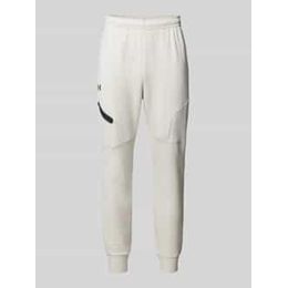 Under Armour Relaxed Fit Sweatpants mit Logo-Print Modell 'Unstoppable'