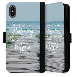 DeinDesign iPhone Xs Handy Klapph&uuml;lle Handyh&uuml;lle aus Kunst Leder schwarz Flip Case Statement Beach Spruch Sideflip mit langer Lasche