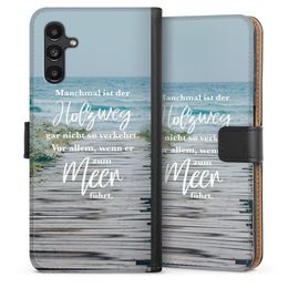 DeinDesign Galaxy A13 5G Handy Klapph&uuml;lle Handyh&uuml;lle aus Kunst Leder schwarz Flip Case Statement Beach Spruch Sideflip mit langer Lasche