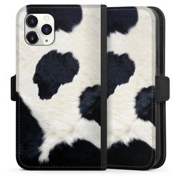 DeinDesign iPhone 11 Pro Handy Klapph&uuml;lle Handyh&uuml;lle aus Kunst Leder schwarz Flip Case Animal Look Animal Print Cow Skin Sideflip mit Lasche