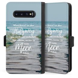 DeinDesign Galaxy S10 Handy Klapph&uuml;lle Handyh&uuml;lle aus Kunst Leder schwarz Flip Case Statement Beach Spruch Sideflip mit Lasche