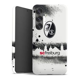 DeinDesign Galaxy S25 Handy Premium Case Smartphone Handyh&uuml;lle Schutzh&uuml;lle gl&auml;nzend Skyline Sc Freiburg Logo Premium Case
