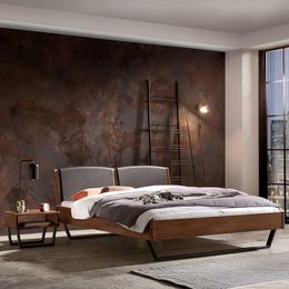 Pharao24.de Doppelbett aus Nussbaum Massivholz und Stahl 216 cm tief