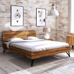 Pharao24.de Futonbett aus Wildeiche Massivholz und Stahl Industriedesign