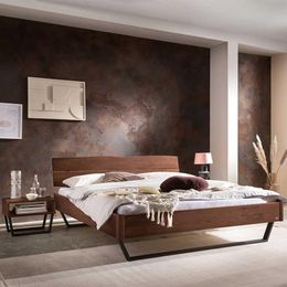 Pharao24.de Factory Style Doppelbett aus Nussbaum Massivholz Bügelgestell