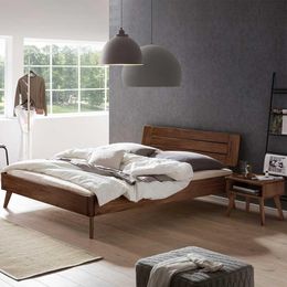 Pharao24.de Nussbaumholz Bett 140x200 cm in modernem Design auch mit Nachtkommode