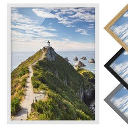 Bilderwelten Bild mit Rahmen - Hochformat Nugget Point Leuchtturm und Meer Neuseeland