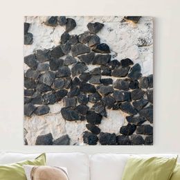 Bilderwelten Leinwandbild Mauer mit Schwarzen Steinen