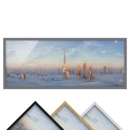 Bilderwelten Bild mit Rahmen - Panorama Dubai &uuml;ber den Wolken