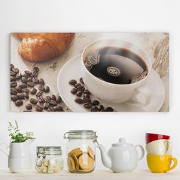 Bilderwelten Leinwandbild - Querformat Dampfende Kaffeetasse mit Kaffeebohnen
