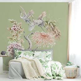 Bilderwelten Fototapete Blumen Illustration Aquarell gr&uuml;n - Aquarell St&ouml;rche im Flug mit Blumen auf Gr&uuml;n - Ranke Wohnzimmer Schlafzimmer