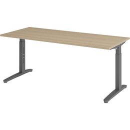 eurokraft pro ANNY - Schreibtisch mit C-Fußgestell, höhenverstellbar 650 - 850 mm, Breite 1800 mm, Eiche / graphit