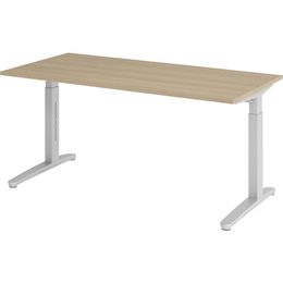 eurokraft pro ANNY - Schreibtisch mit C-Fußgestell, höhenverstellbar 650 - 850 mm, Breite 1600 mm, Eiche / alusilber