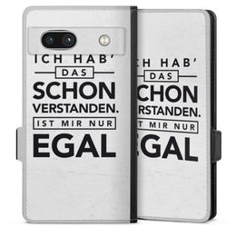 DeinDesign Google Pixel 7a Handy Klapph&uuml;lle Handyh&uuml;lle aus Kunst Leder schwarz Flip Case Spruch Sayings Statement Sideflip mit Lasche