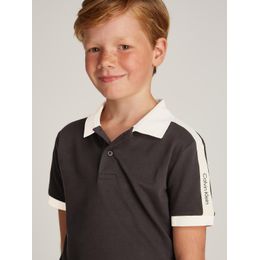 Jungen Poloshirt "SS POLO PIQUE WITH TAPE", schwarz, Gr. 6, Calvin Klein Jeans, unifarben mit Farbeinsätzen, Piqué, Obermaterial: 94% Baumwolle, 6%