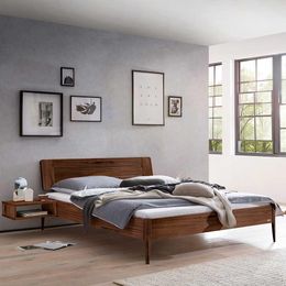 Pharao24.de Massives Nussbaum Bett 140x200 cm wahlweise mit Nachtkonsolen