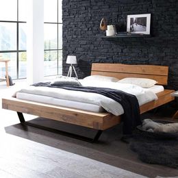 Pharao24.de Niedriges Bett aus Wildeiche Massivholz und Metall Loft Design
