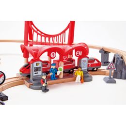 HAPE Kinder Spielzeugeisenbahn-Geb&auml;ude "Eisenbahn-Set - Verkehrsreiche Stadt", bunt, Holz, Kunststoff, B:85cm H:20cm T:76cm,