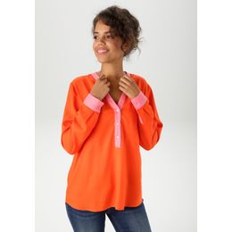 Schlupfbluse Aniston CASUAL, Damen, Gr. 48, pink (orange pink), Web, Obermaterial: 100% Viskose (LENZING&trade; ECOVERO&trade;), unifarben mit Farbeinsatz, figurumspielend Po-bedeckend, V-Ausschnitt, 1-Knopf-Manschette, Blusen Schlupfbluse, mit pinkfarbenen Akzenten