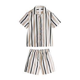 next Set: Badeshorts und Badehemd Jungen Gr&ouml;&szlig;e 104 beige / schwarz / wei&szlig;