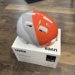 Uvex HLMT 4 Kinder-Helm grapefruit - grey 55-58 cm