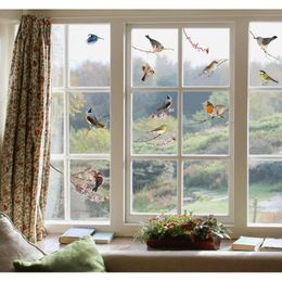 Komar Fensterbild &raquo;V&ouml;gel, birds, 12 sch&ouml;ne, verspielte Motive, Design Fr&uuml;hling&laquo; Sticker f&uuml;r Fenster oder Spiegel, selbsthaftend und wiederverwendbar bunt 