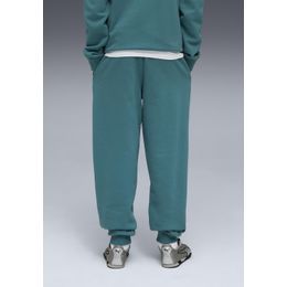 Puma Jungen Trainingshose "ESS NO. 1 LOGO SWEATPANTS FL B", gr&uuml;n, Gr. 176, unifarben, Fleece, Obermaterial: 66% Baumwolle, 34% Polyester, Hosen,