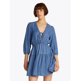 Blusenkleid Tommy Jeans "TJW CHAMBRAY MINI DRESS EXT", Damen, Gr. L (40), N-Gr, blau (denim medium), Web, Obermaterial: 100% Lyocell, unifarben, ausgestellt Mini, V-Ausschnitt, elastischer Bund, Kleider Blusenkleid, mit Volant, in Mini-L&auml;nge