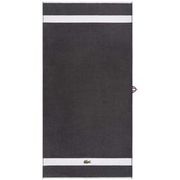 Duschtuch Lacoste "LCASUAL", bitume, B:70cm L:140cm, Frottier, Baumwolle, Handt&uuml;cher, mit Label-Applikationen und Bord&uuml;re