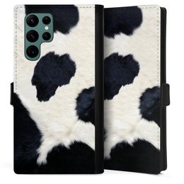 DeinDesign Galaxy S22 Ultra Handy Klapph&uuml;lle Handyh&uuml;lle aus Kunst Leder schwarz Flip Case Animal Look Animal Print Cow Skin Sideflip mit langer Lasche