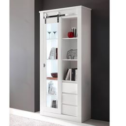 Pharao24.de B&uuml;chervitrine Wohnzimmerschrank mit drei Schubladen und Glast&uuml;r