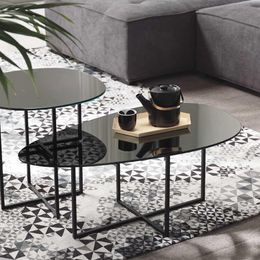 Pharao24.de Couchtisch mit Glasplatte und Metall B&uuml;gelgestell 90 cm breit