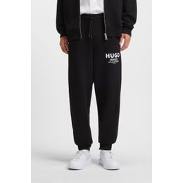 Jogginghose Hugo "Nevez", Herren, Gr. L, N-Gr, schwarz (schwarz005), Sweatware, Obermaterial: 100% Baumwolle, unifarben, oversize lang, Hosen Jogginghose, mit Beinb&uuml;ndchen und Oversize-Passform