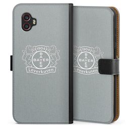 DeinDesign Galaxy XCover 6 Pro Handy Klapph&uuml;lle Handyh&uuml;lle aus Kunst Leder schwarz Flip Case Bayer 04 Leverkusen Official Licensed Product Coat Of Arms Sideflip 