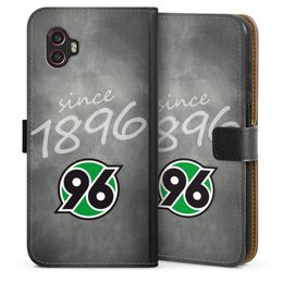 DeinDesign Galaxy XCover 6 Pro Handy Klapph&uuml;lle Handyh&uuml;lle aus Kunst Leder schwarz Flip Case Official Licensed Product H96 Hannover 96 Sideflip mit langer Lasche