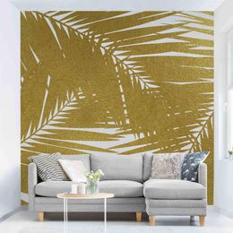 Fototapete Blick durch goldene Palmenbl&auml;tter