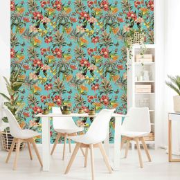 Mustertapete Tropische Blumen vor Blau