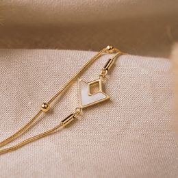 Holzkern Conceptual Armband Damen Gold und Perlmutt