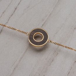 Holzkern Ornament Armband Damen Gold und Leadwood