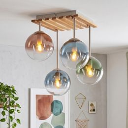 hofstein Cluster-Deckenleuchte Gastor mit 4 Glaskugeln in Blau, Gr&uuml;n, Klar und Kupferfarben Aus Holz in Naturfarben und Metall, &oslash; 15 cm, E14, 25 Watt