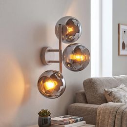 hofstein Moderne Kugel-Wandleuchte Koyoto mit drei vertikal angeordneten Chrom-Rauchglasschirmen Metallgestell in Sandfarben, E14, 25 Watt, extern dimmbar