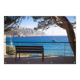 Wallario Gartenposter ca. 120 x 180 cm Einsame Bank am Meer - Spanien im Sommer