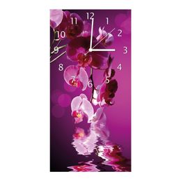 Wallario Uhr 30 x 60 cm, schwarze Zeiger Rosafarbene Orchidee Bl&uuml;ten in pink