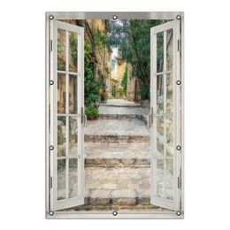 Wallario Gartenposter ca. 100 x 150 cm mit Fenster-Illusion Alte steinerne Gasse in S&uuml;dfrankreich