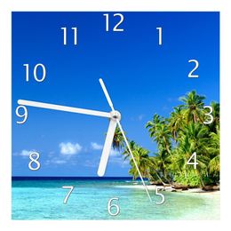 Wallario Uhr 30 x 60 cm, wei&szlig;e Zeiger Blauer Himmel wei&szlig;er Strand Palmen und das tiefblaue Meer