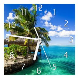 Wallario Uhr 30 x 60 cm, wei&szlig;e Zeiger Karibisches Meer ? Einsame H&uuml;tte unter Palmen